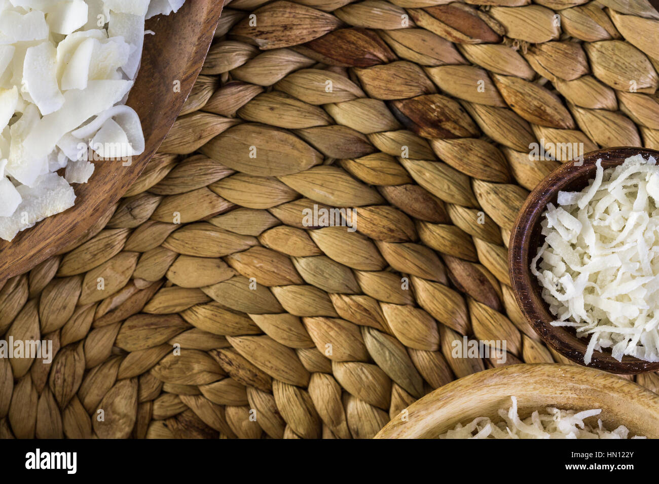 Dehydrated coconut flakes in wooden bowl Stock Photo - Alamy