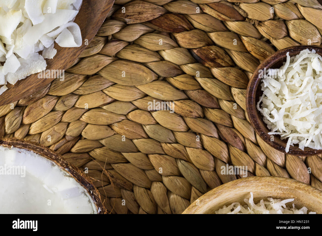 Dehydrated coconut flakes in wooden bowl Stock Photo - Alamy