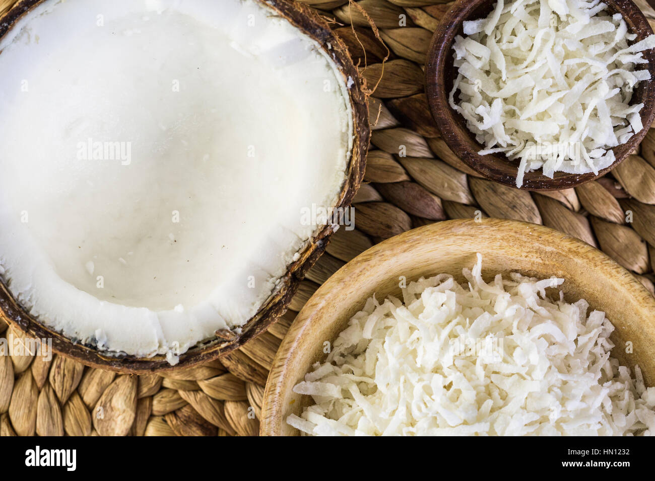 Dehydrated coconut flakes in wooden bowl Stock Photo - Alamy