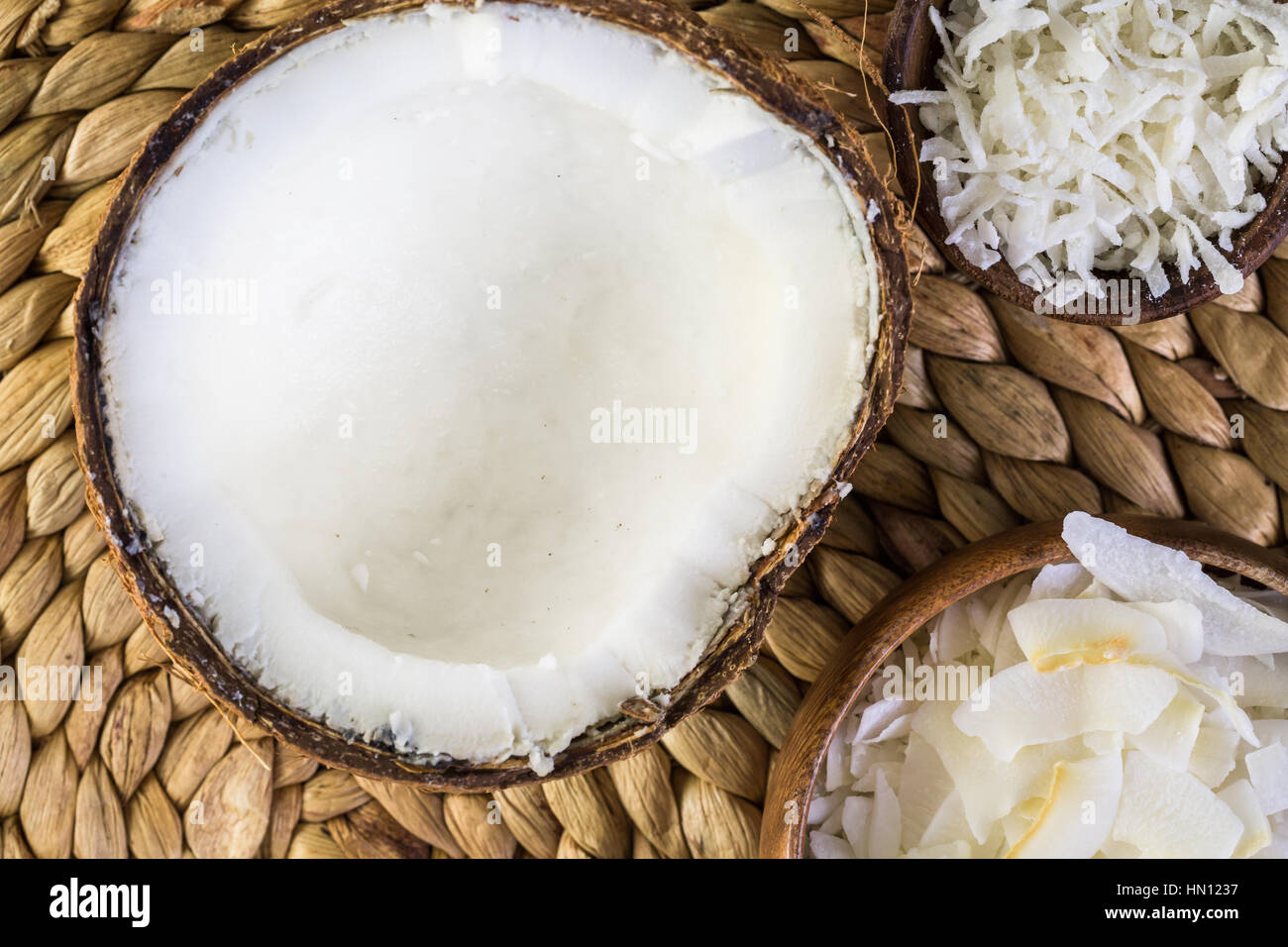 Dehydrated coconut flakes in wooden bowl Stock Photo - Alamy