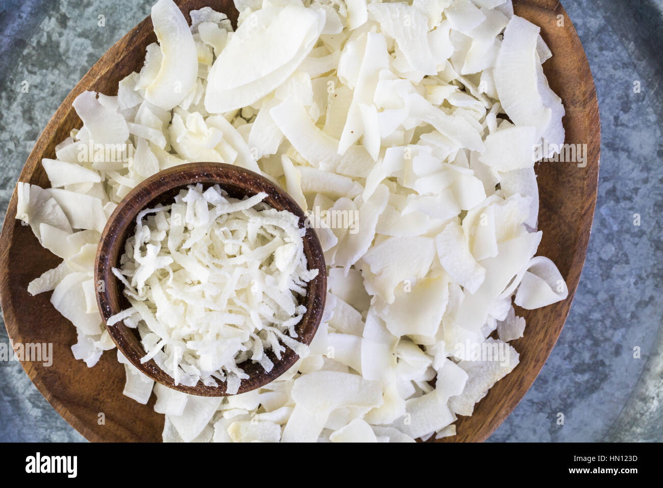 Dehydrated coconut flakes in wooden bowl Stock Photo - Alamy