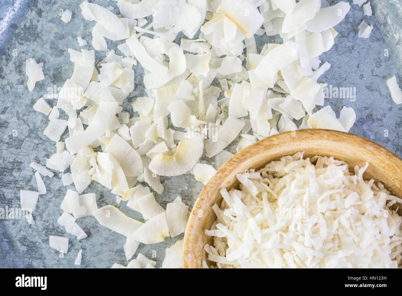 Dehydrated coconut flakes in wooden bowl Stock Photo - Alamy