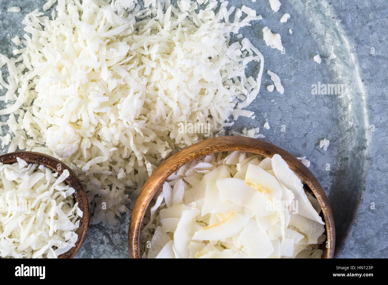 Dehydrated coconut flakes in wooden bowl Stock Photo - Alamy