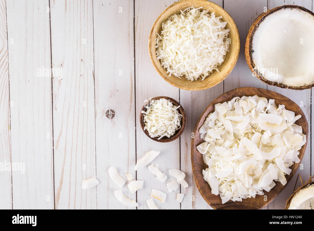 Dehydrated coconut flakes in wooden bowl Stock Photo - Alamy