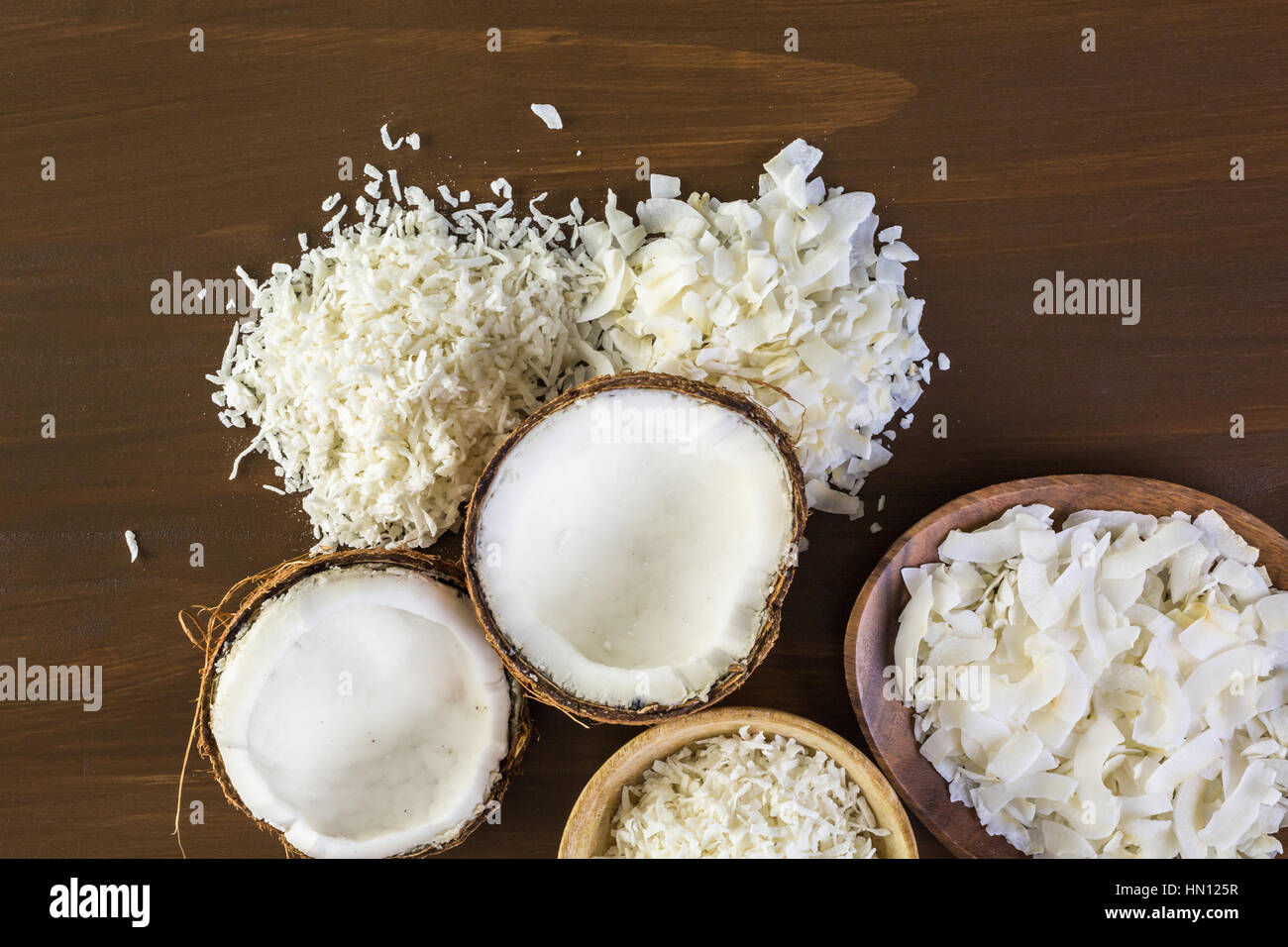 Dehydrated coconut flakes in wooden bowl Stock Photo - Alamy