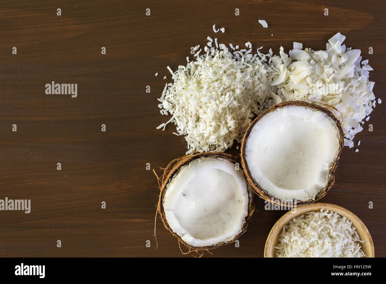 Dehydrated coconut flakes in wooden bowl Stock Photo - Alamy