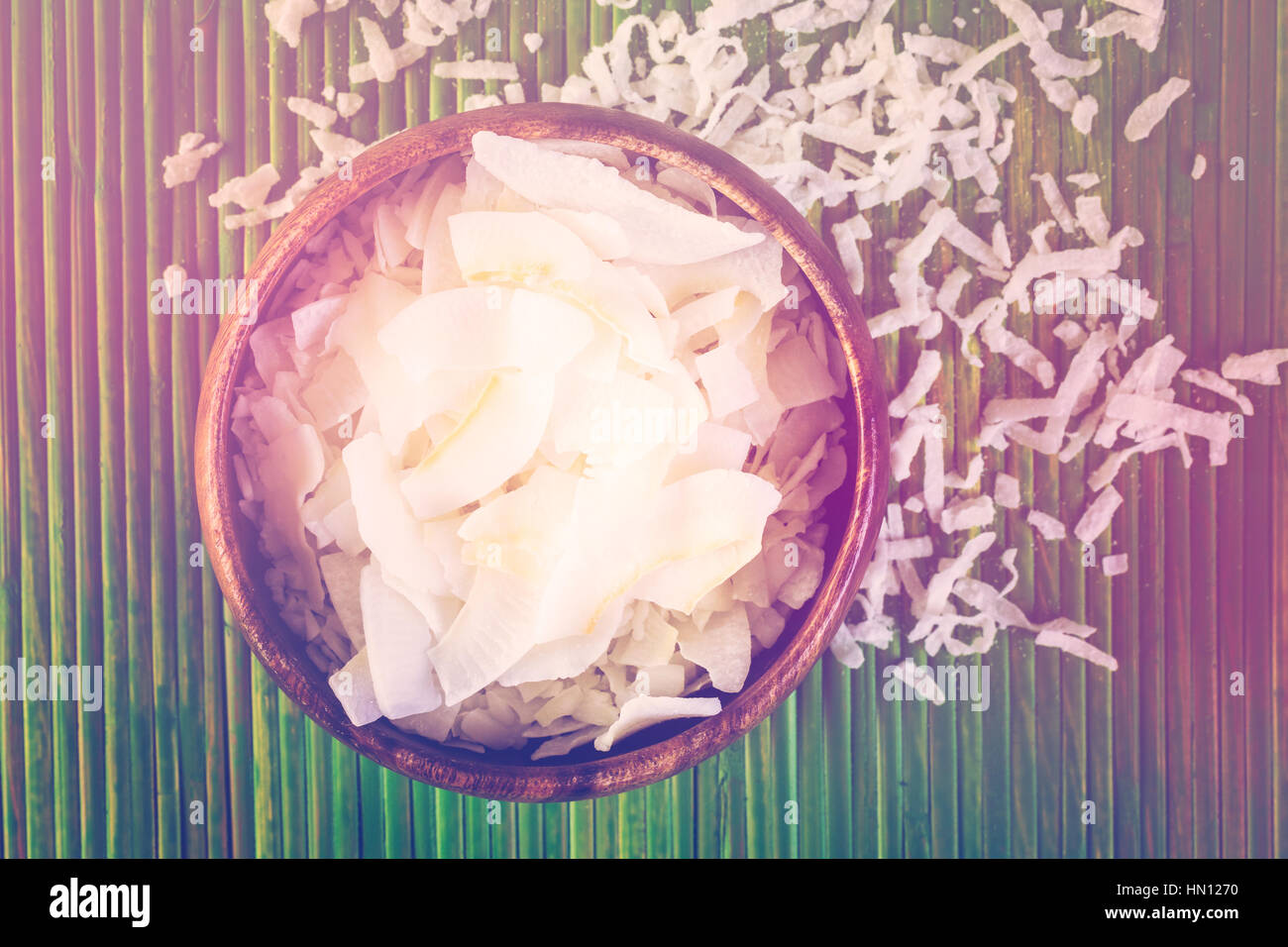Dehydrated coconut flakes in wooden bowl Stock Photo - Alamy