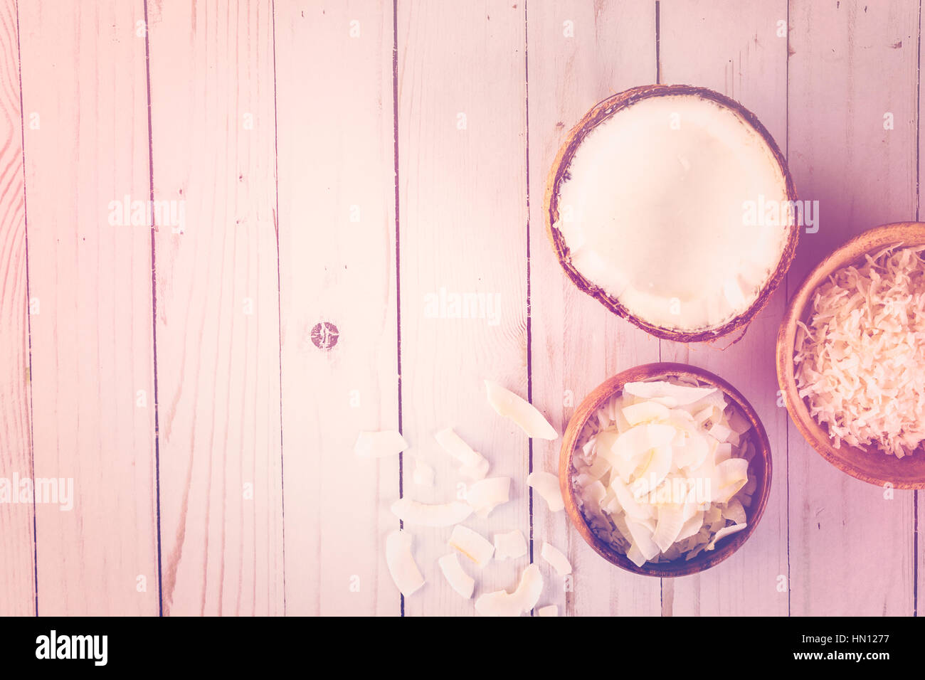 Dehydrated coconut flakes in wooden bowl Stock Photo - Alamy
