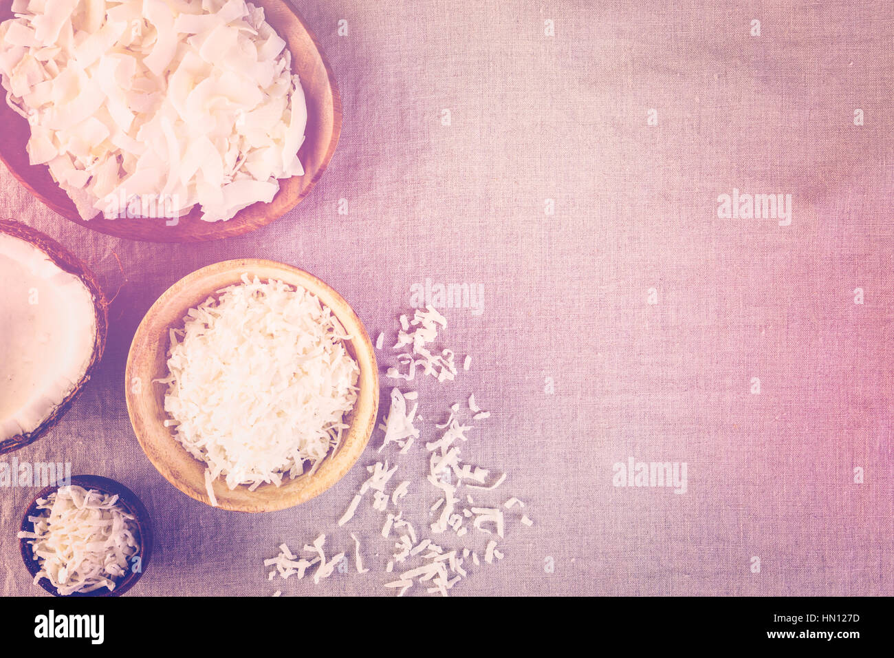 Dehydrated coconut flakes in wooden bowl Stock Photo - Alamy