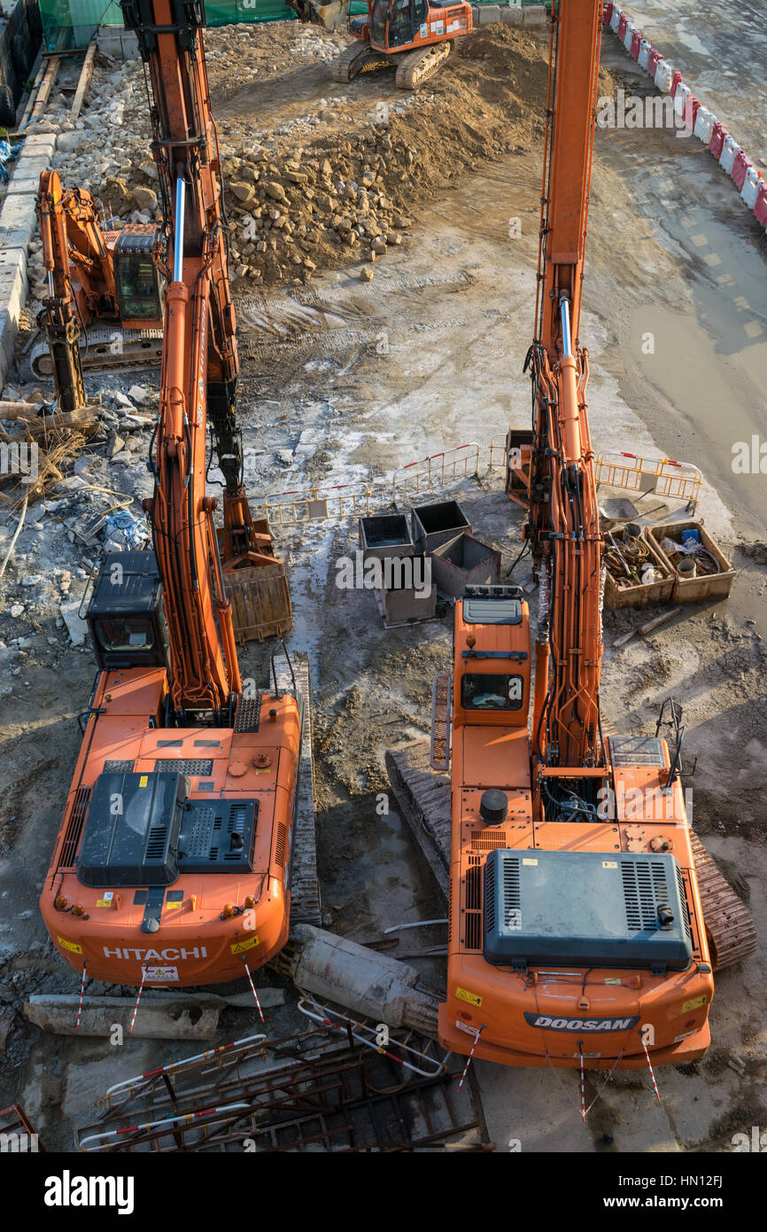 Two orange cranes at a construction site in Hong Kong Stock Photo - Alamy