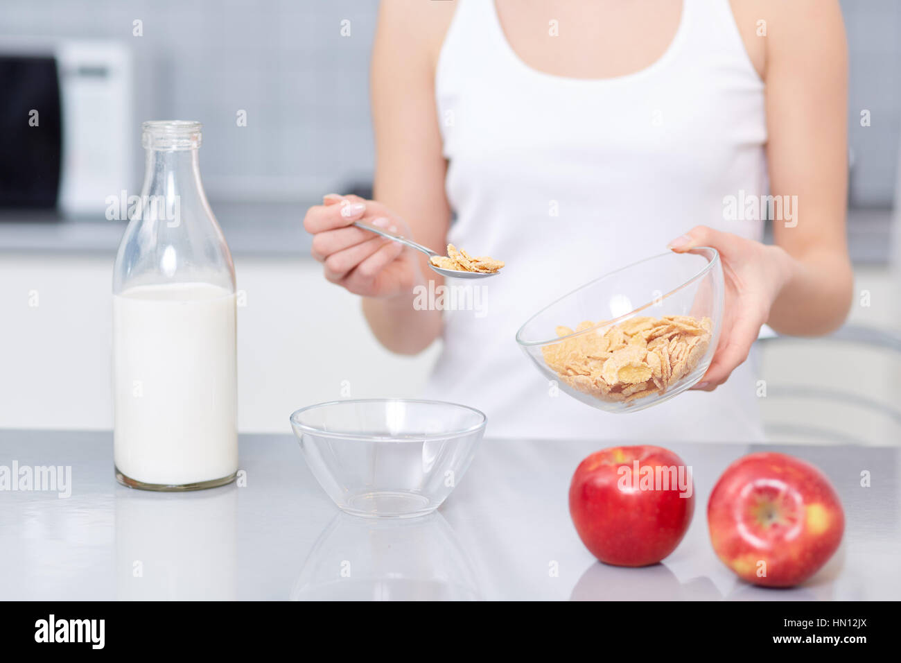 Female cooking breakfast at modern kitchen Stock Photo - Alamy