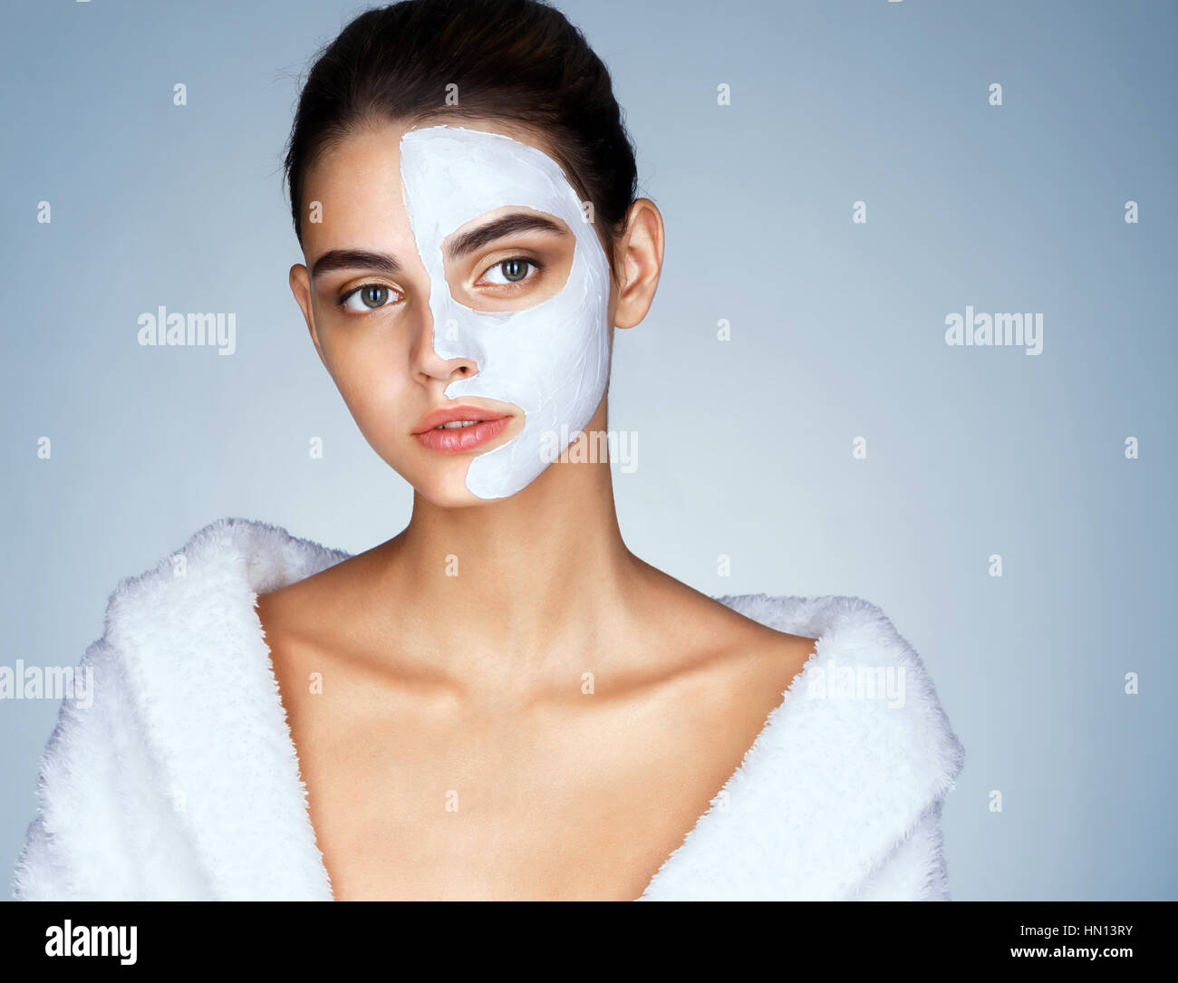 Gorgeous woman with cosmetic mask on her face. Photo of attractive ...