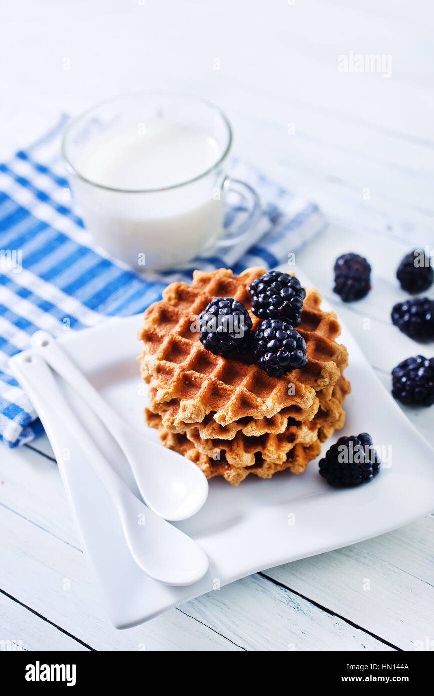waffles on plate and on a table Stock Photo - Alamy