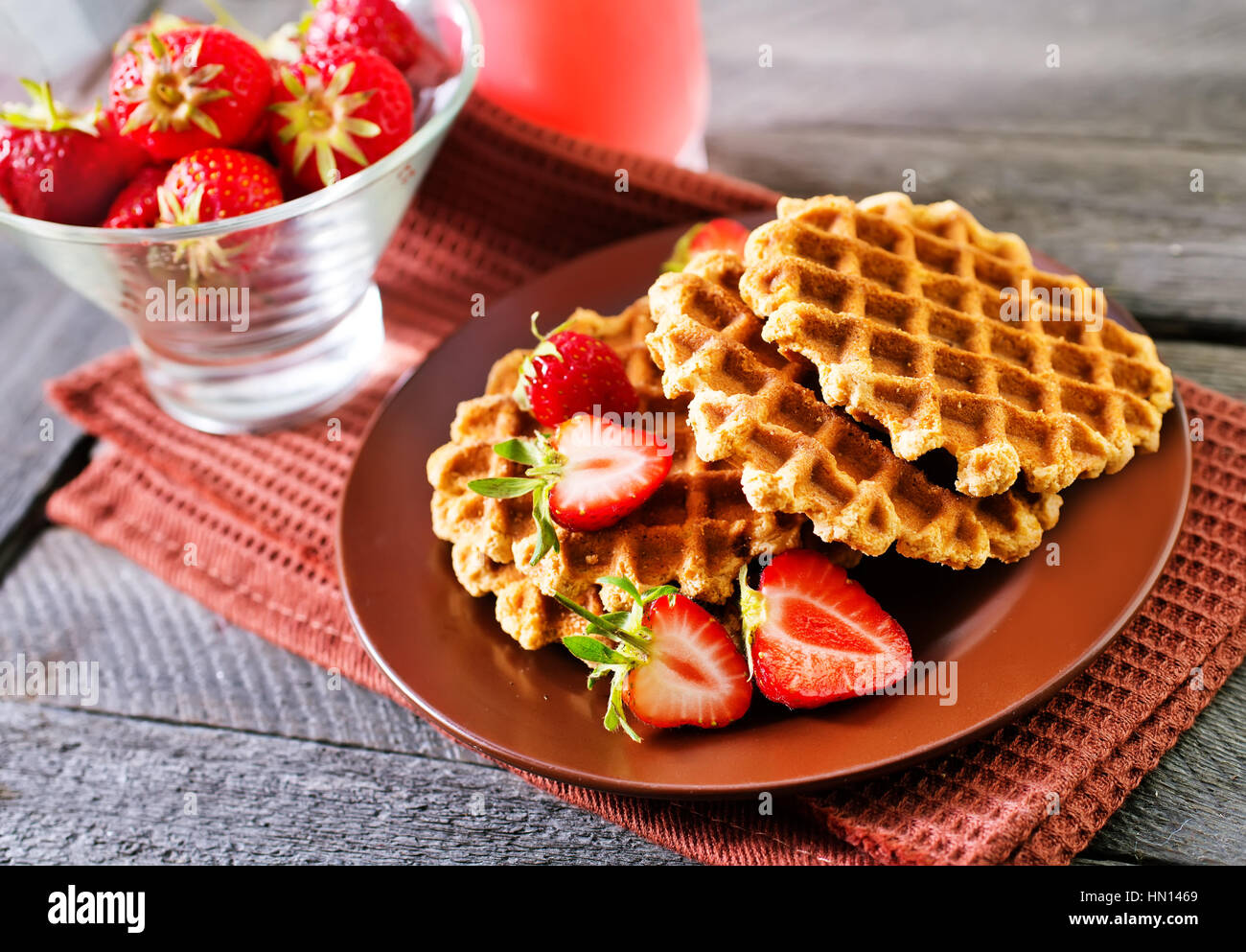 waffles on plate and on a table Stock Photo - Alamy