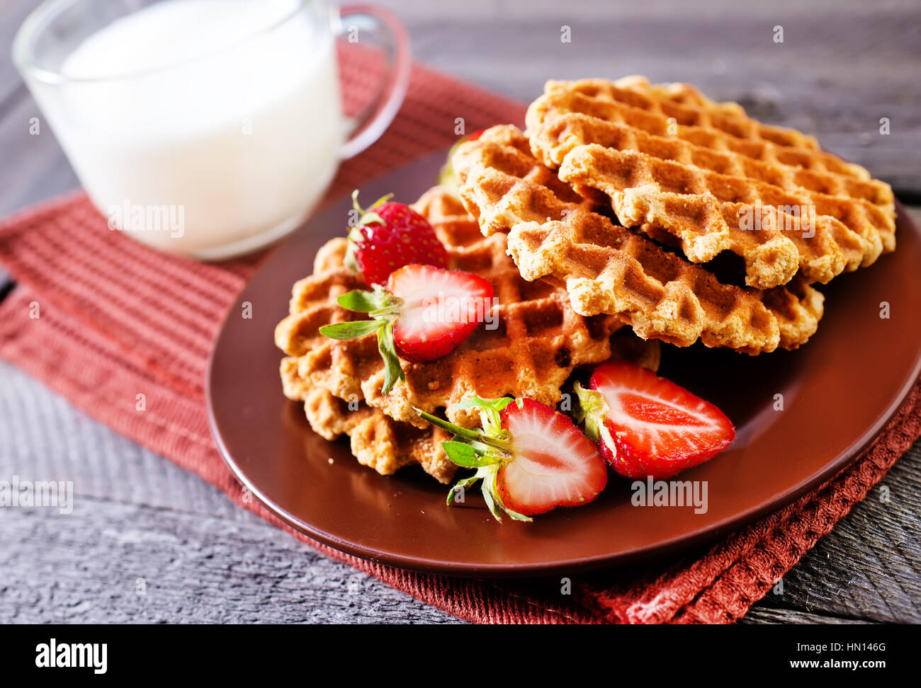 waffles on plate and on a table Stock Photo - Alamy
