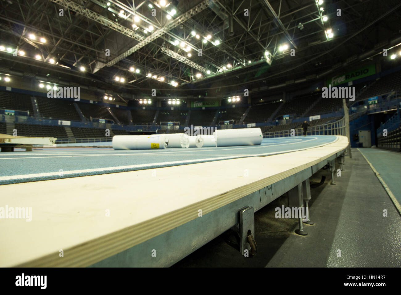Workers laying the new infield track at the National Indoor Arena in ...
