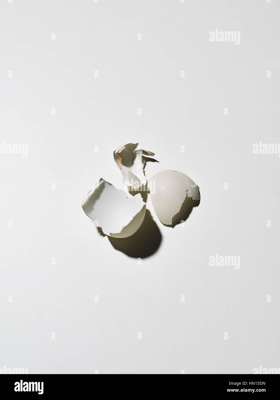 Cracked egg shell on white background Stock Photo - Alamy