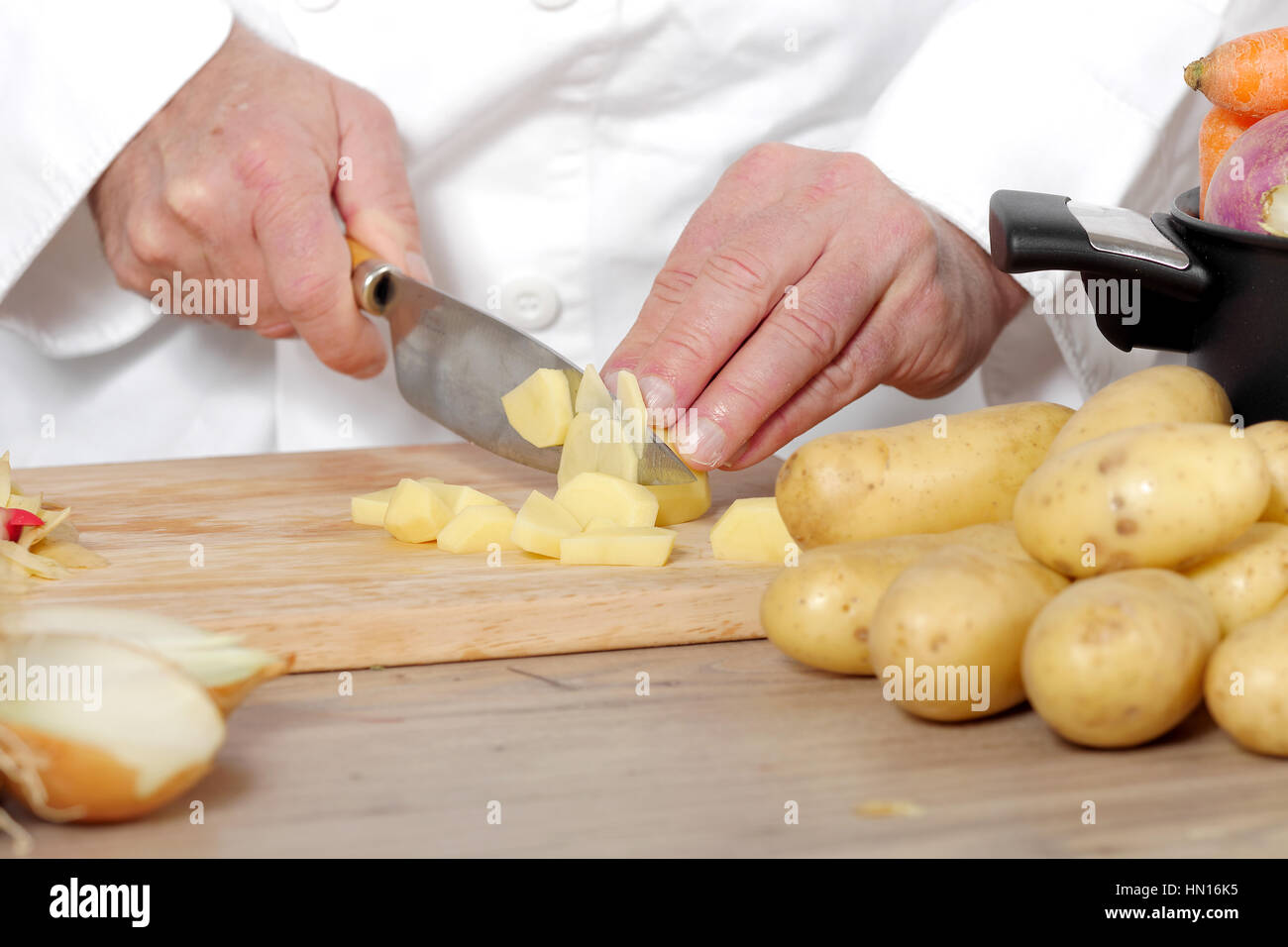 detail of hands of a chef slicing potatoes Stock Photo - Alamy