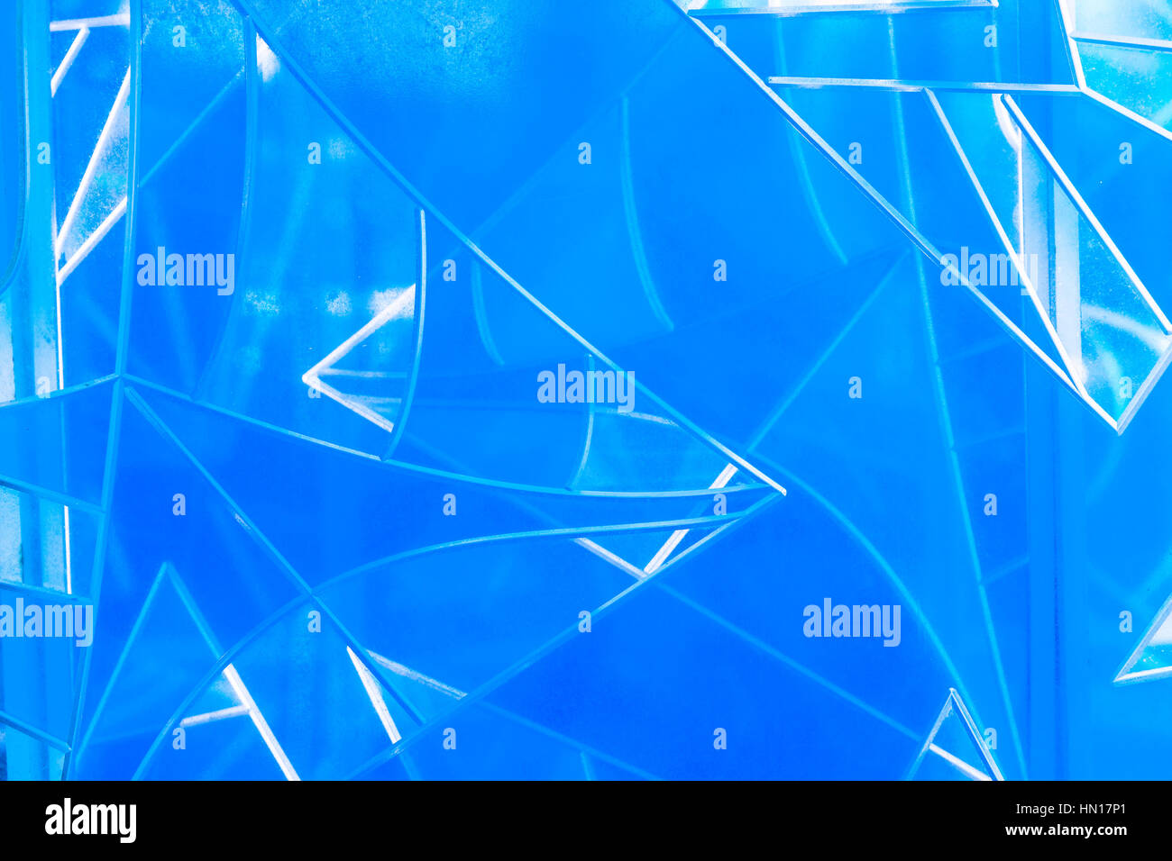 Abstract lines and figures made of blue glass or plastic pieces. Just ...