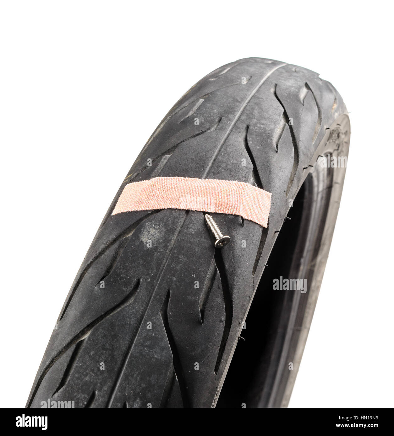 A damaged motorcycle tire first aid plaster Stock Photo - Alamy