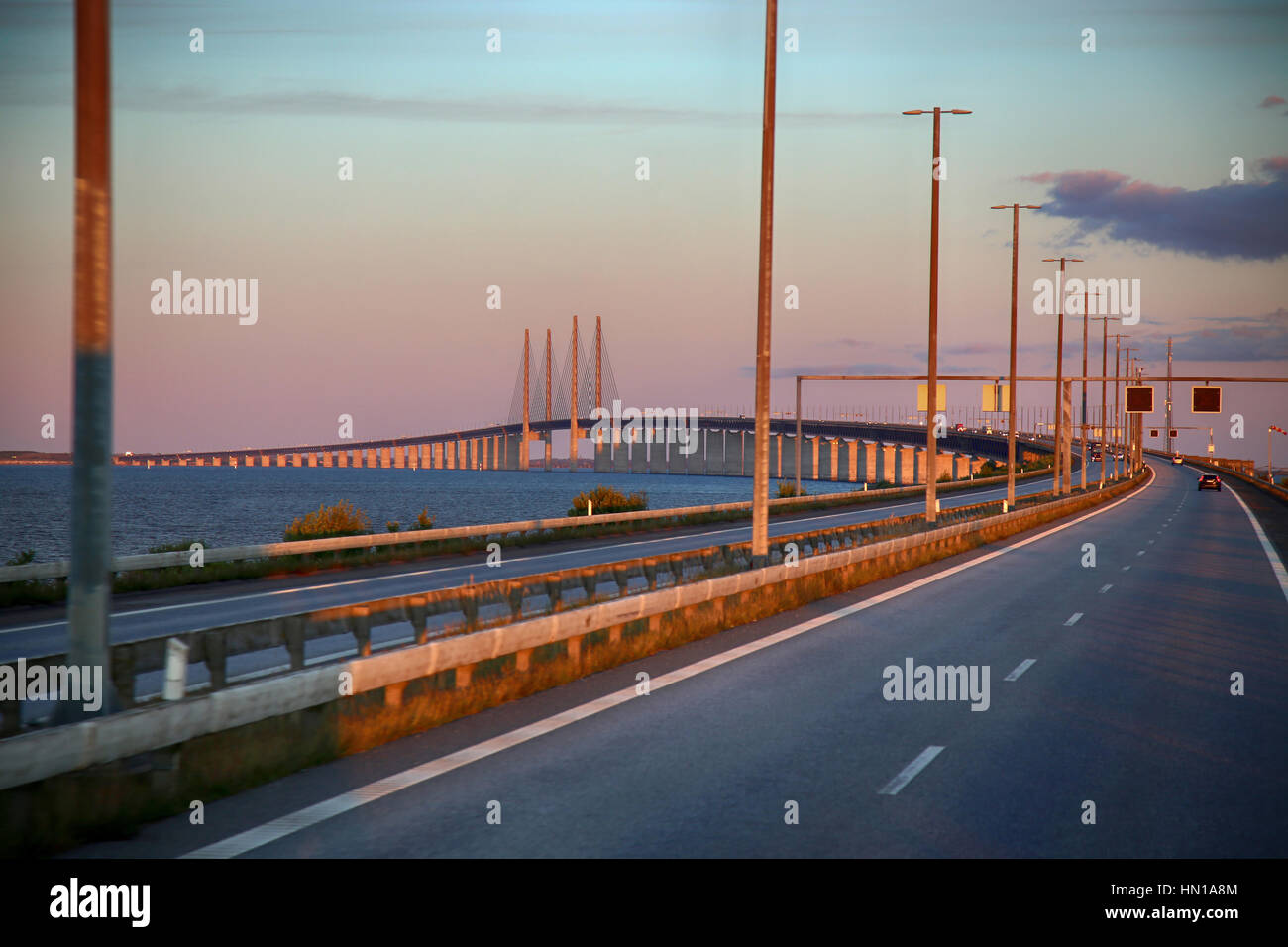 View on Oresund bridge between Sweden and Denmark at sunset Stock Photo ...