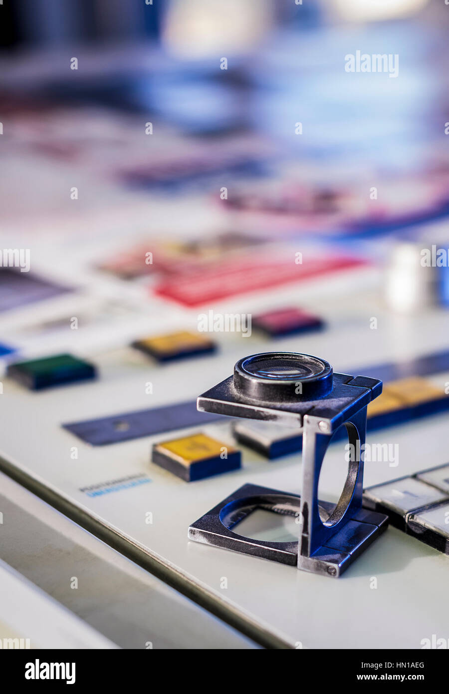 Color management in printing process with magnifying glass Stock Photo ...