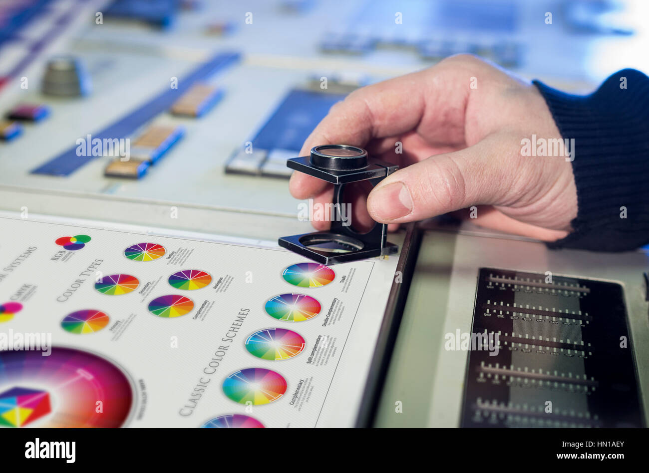 Young man in the process of offset printing and color correction Stock ...