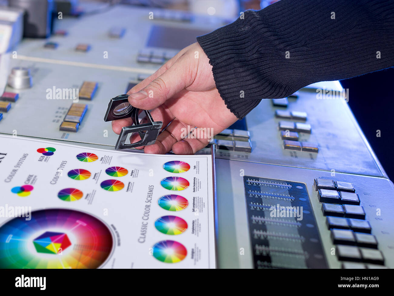 Young man in the process of offset printing and color correction Stock ...