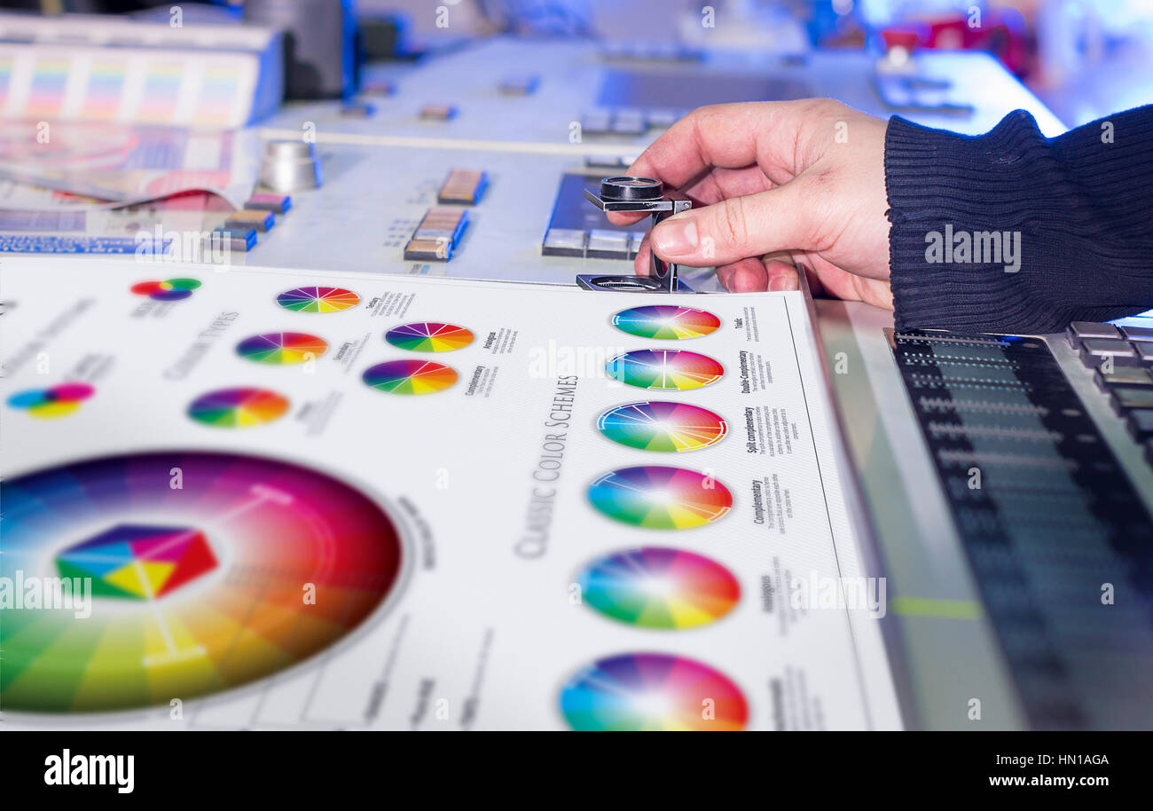 Young man in the process of offset printing and color correction Stock ...