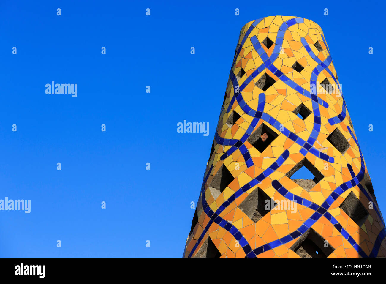 Colourful chimney pods or ventilation shafts on the roof of Palau Guell ...