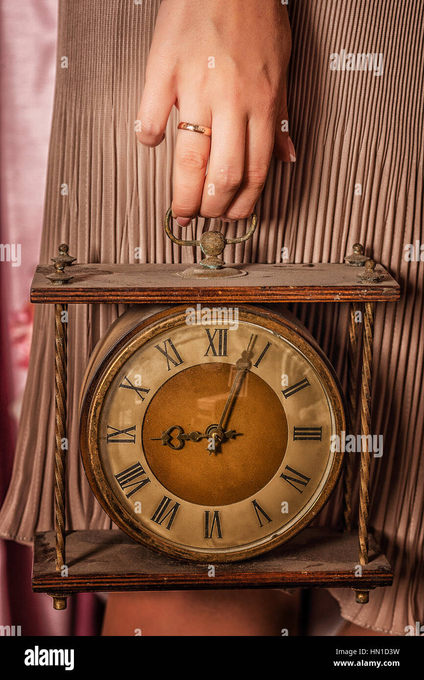 Vintage clock in married woman's hand Stock Photo - Alamy