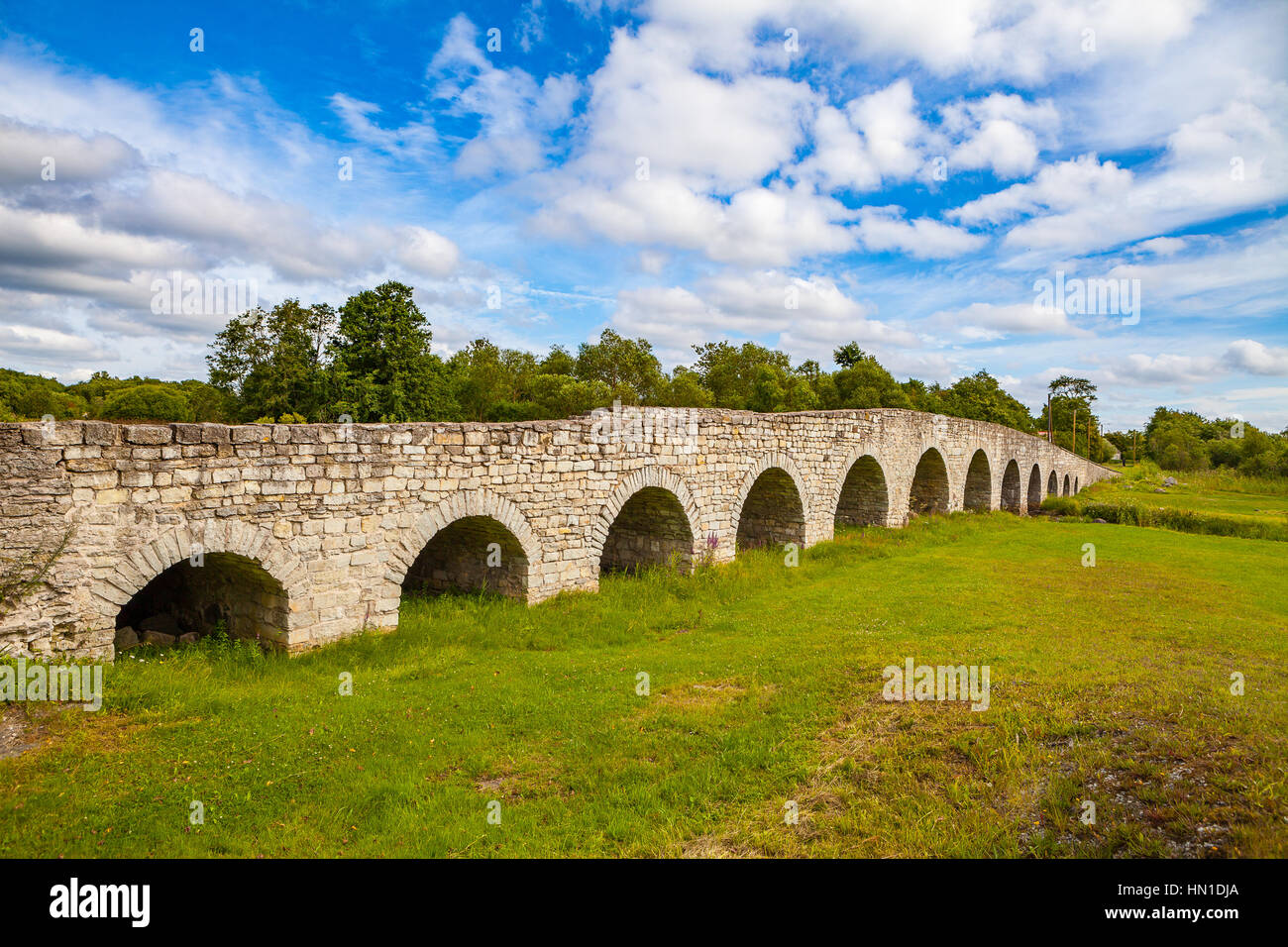 View of the Historic Old Stone Bridge over the river on Estonian island ...
