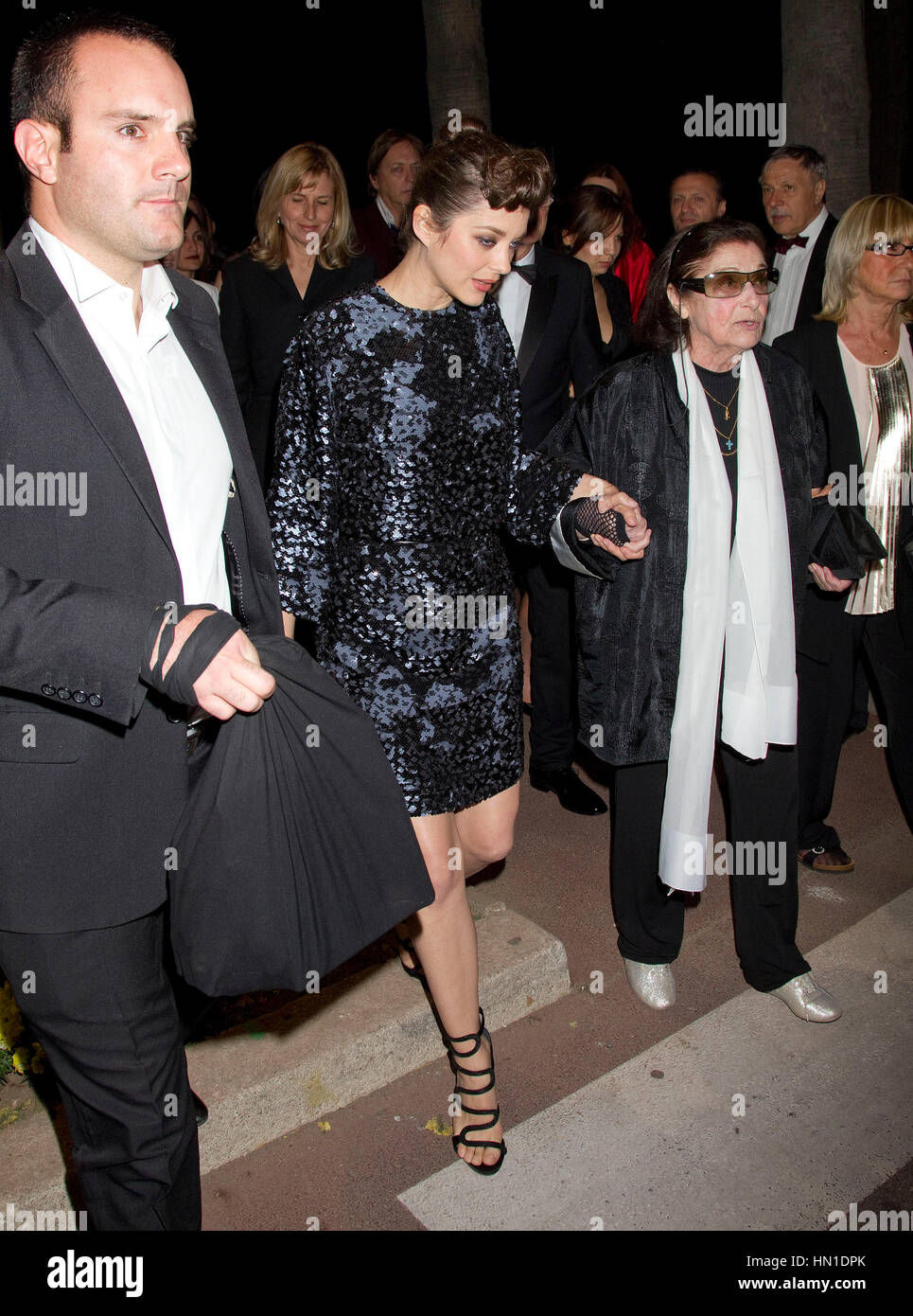 Marion Cotillard walks with a friend on the croisette at the 65th ...