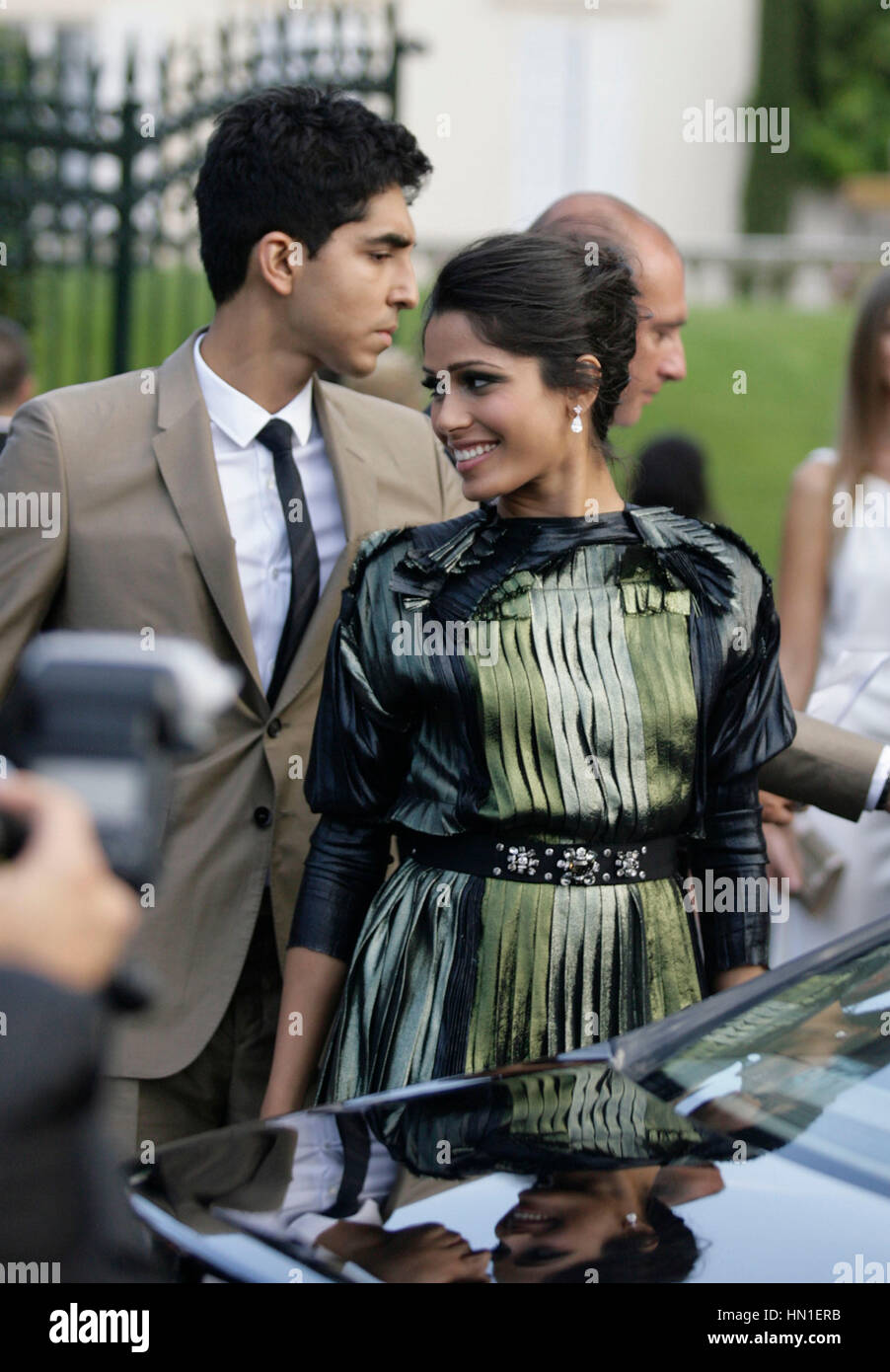 Freida Pinto and Dev Patel arrive at the amFAR gala at the Hotel Du Cap ...
