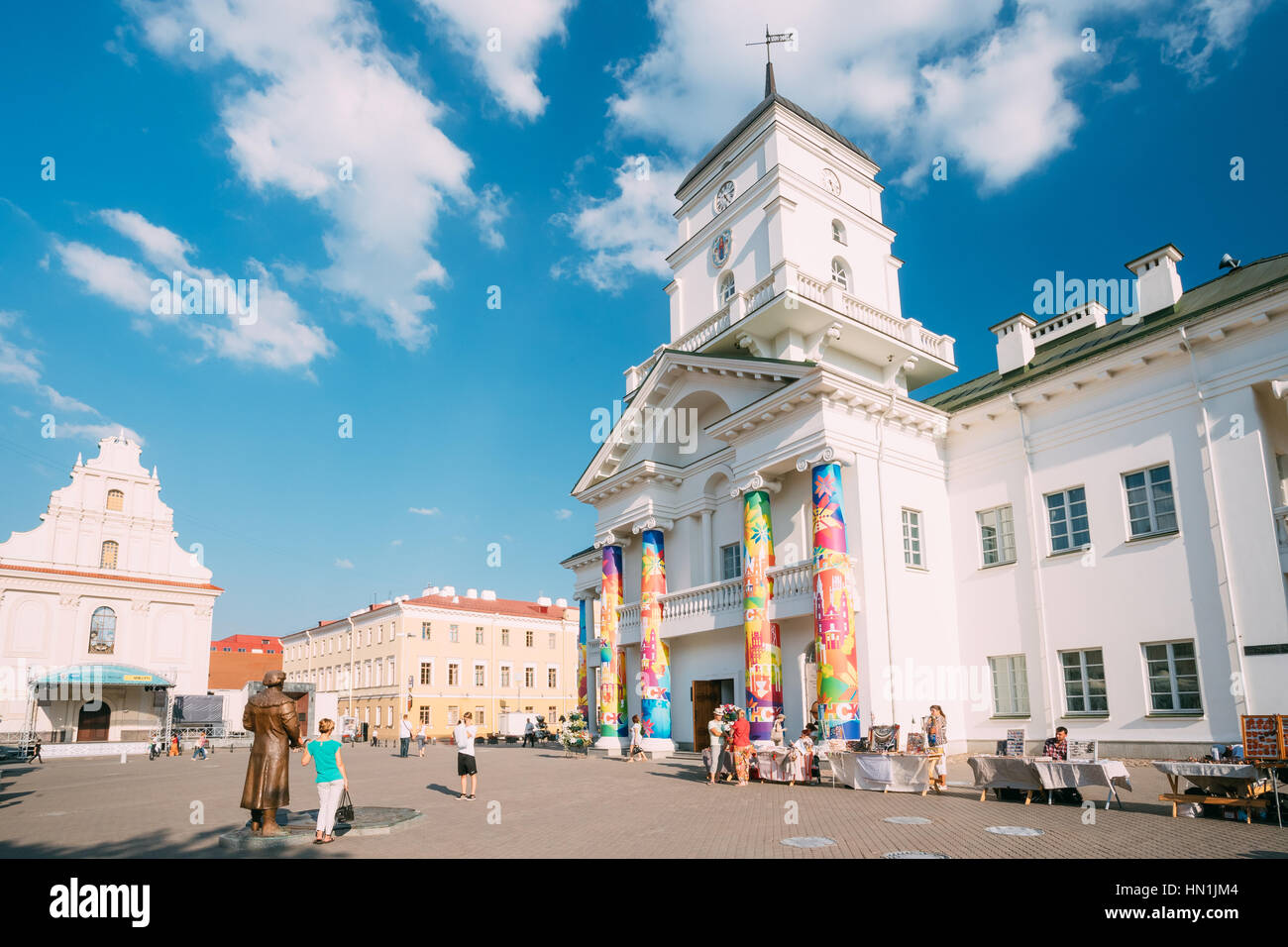 Minsk, Belarus. People Walking On Freedom Square Next To White Building ...