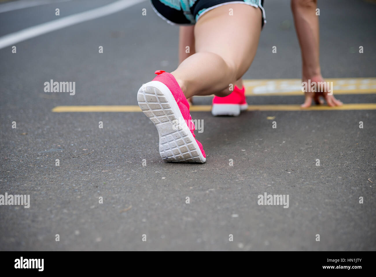 feet running on road closeup on shoe Stock Photo - Alamy