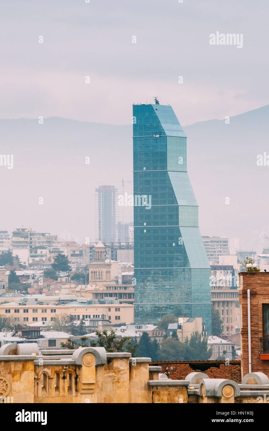 Tbilisi, Georgia. Skyscraper Surrounded By Buildings Of Soviet Time ...