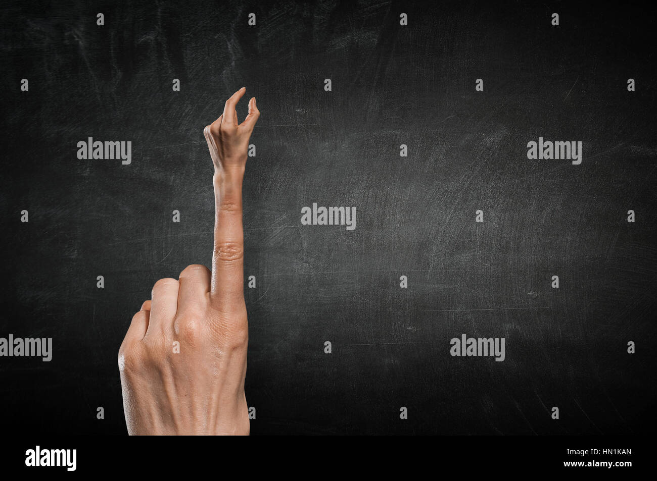 Hand of person taking something between fingers Stock Photo - Alamy