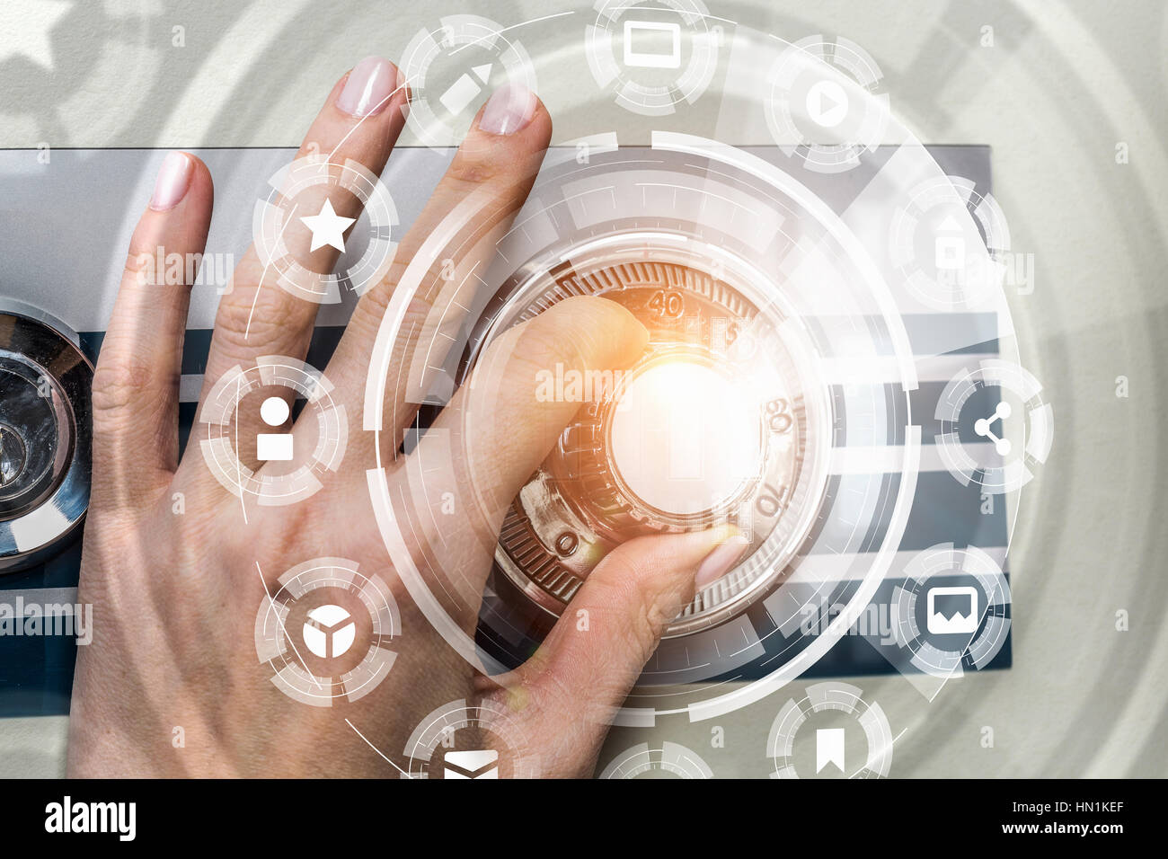 Hands of businesswoman dialing code on safe lock Stock Photo - Alamy