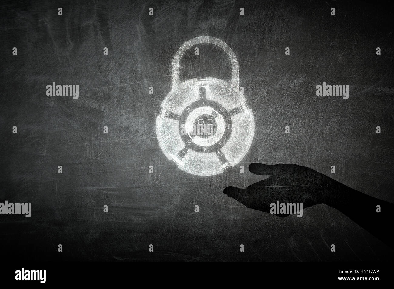 Hand holding lock sign on concrete background Stock Photo - Alamy