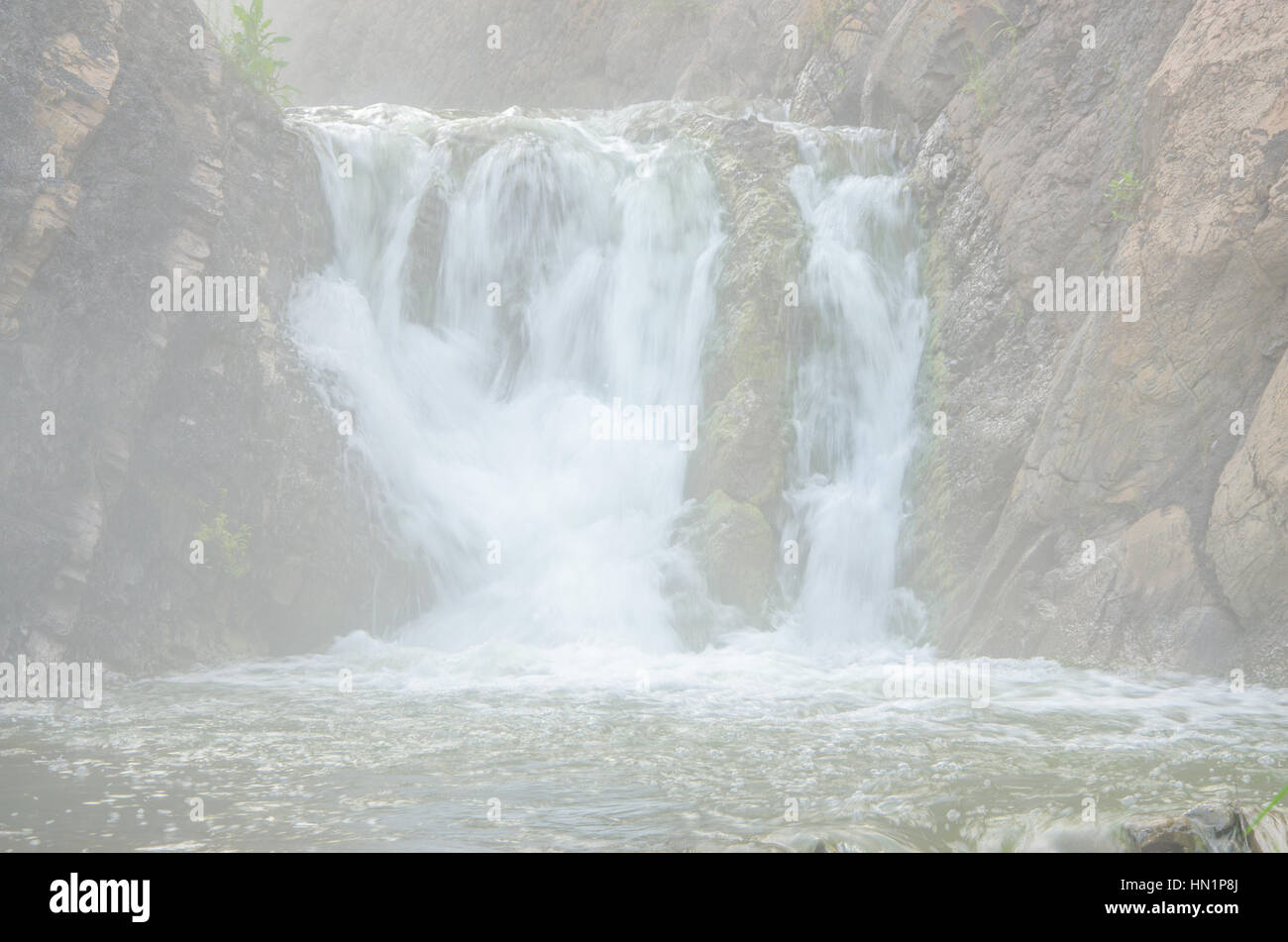 falling water in the morning mist. falling water in the dense morning ...