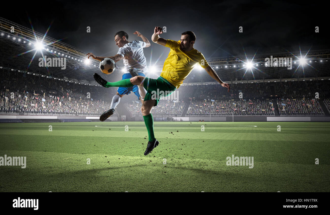 Soccer players in action on stadium fighting for ball. Mixed media ...