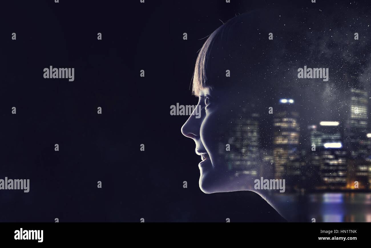 Profile of dreaming kid girl against night city background Stock Photo ...