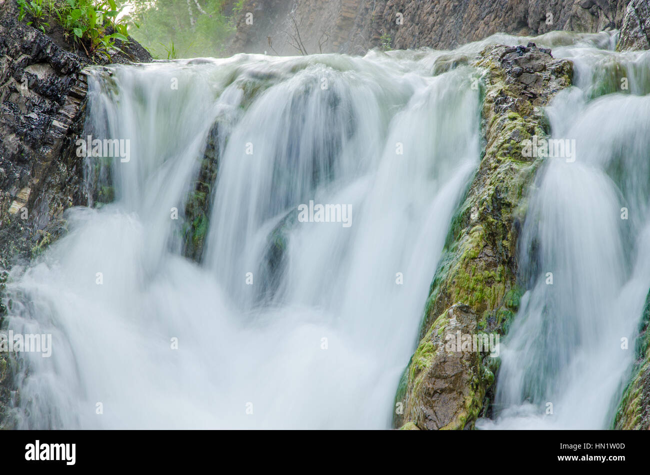 falling water in the morning mist. falling water in the dense morning ...