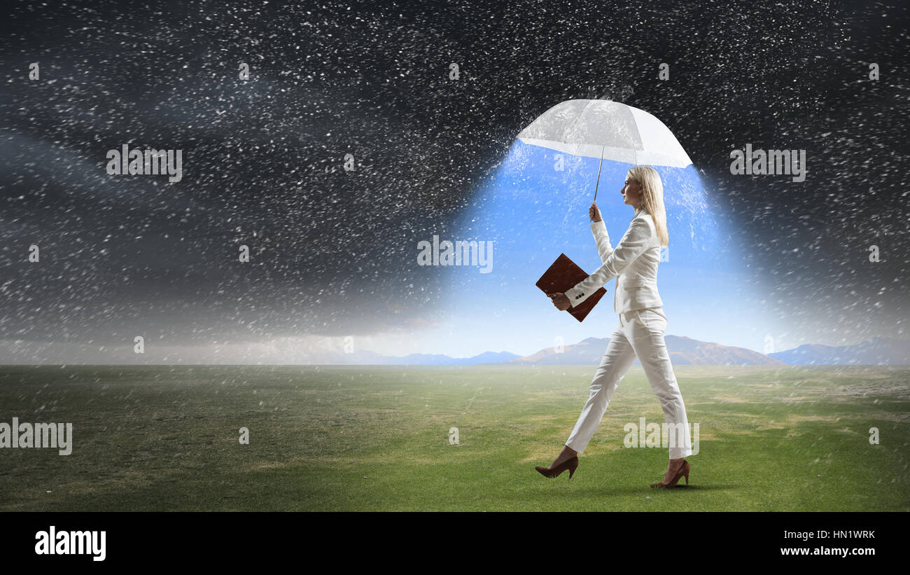 Hidden under umbrella hi-res stock photography and images - Alamy