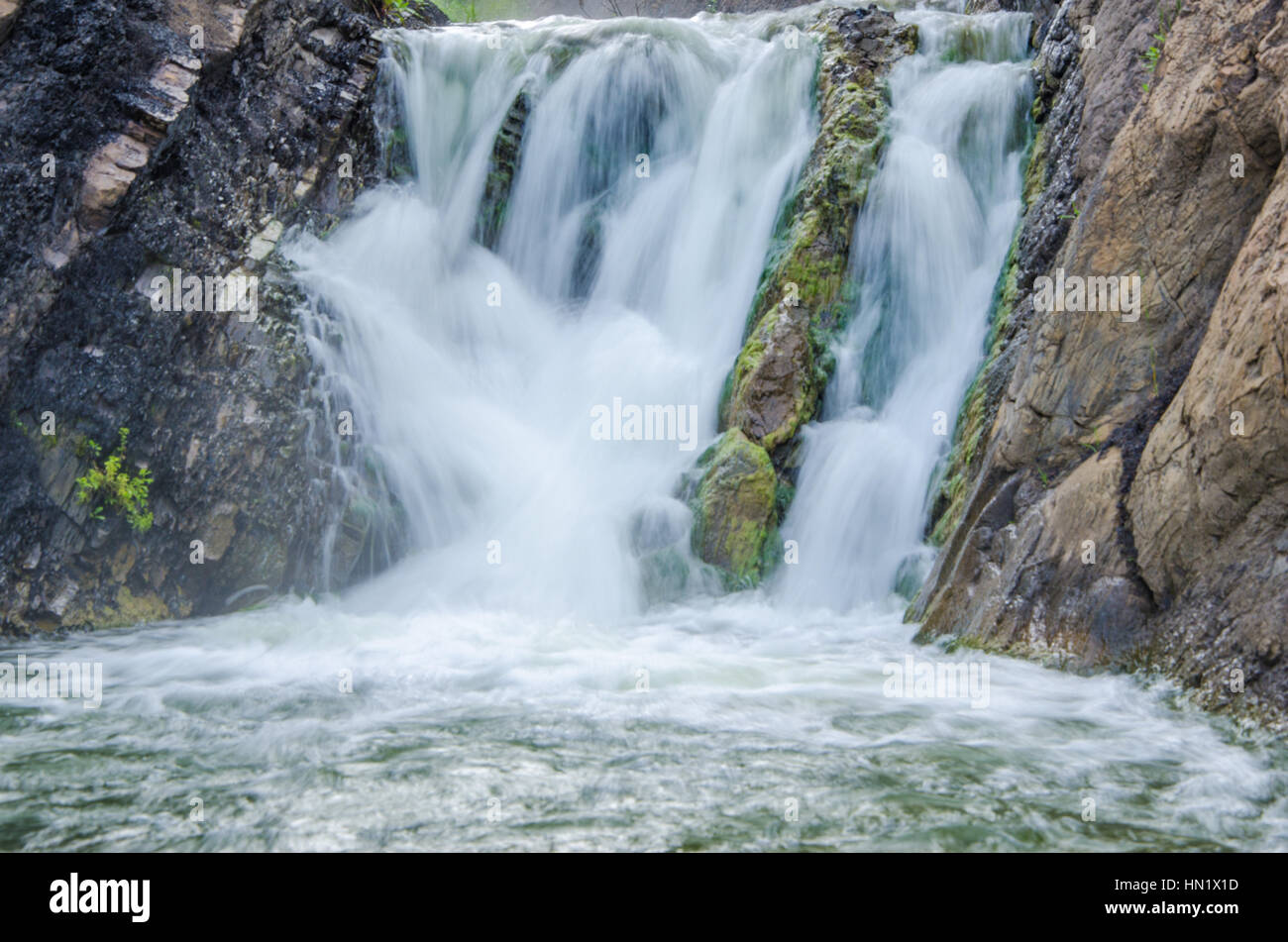 falling water in the morning mist. falling water in the dense morning ...