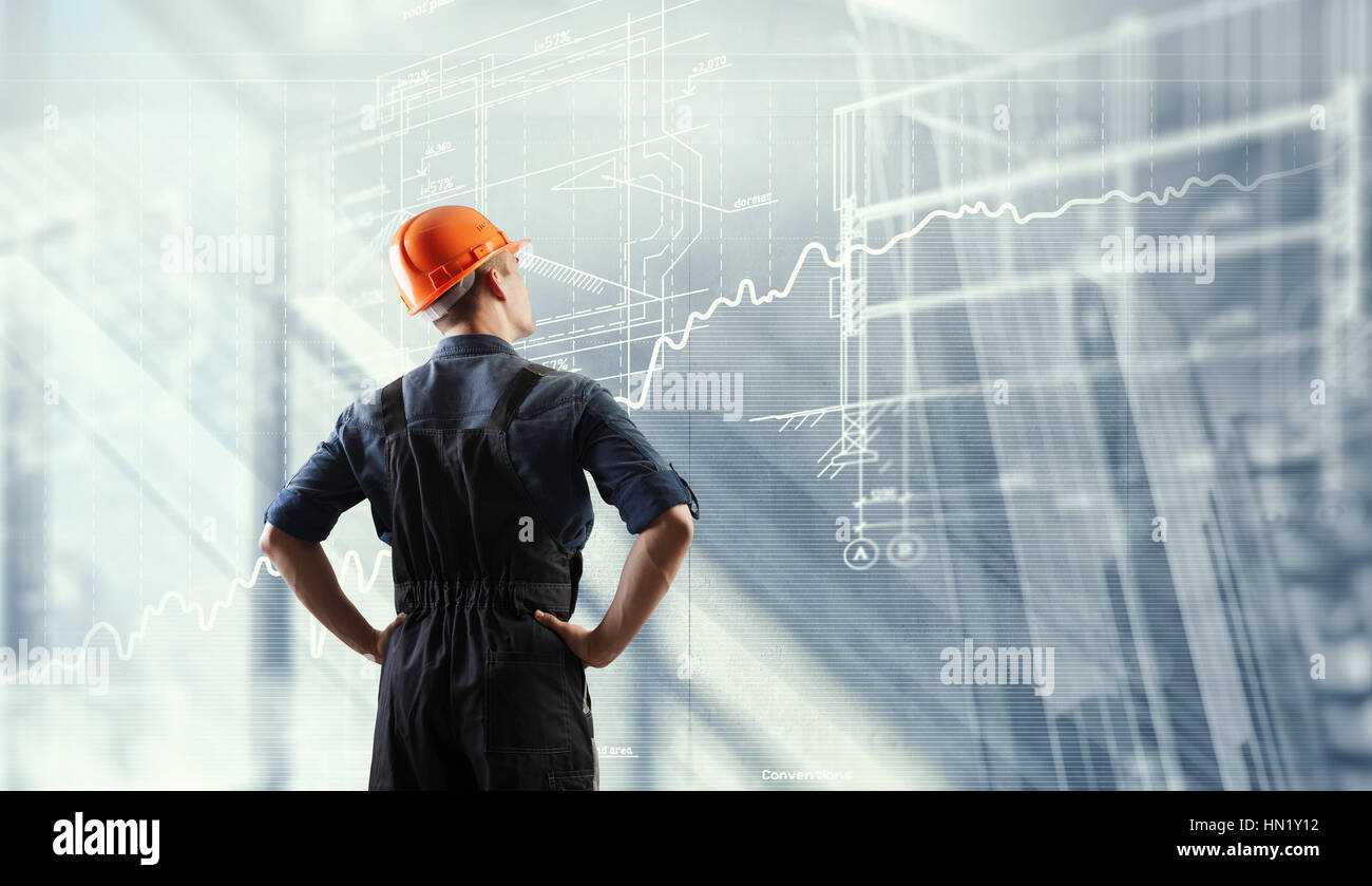 Back view of engineer man looking at virtual panel Stock Photo - Alamy