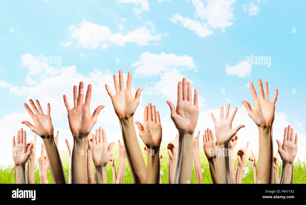 Row of raised hands showing different gestures Stock Photo - Alamy
