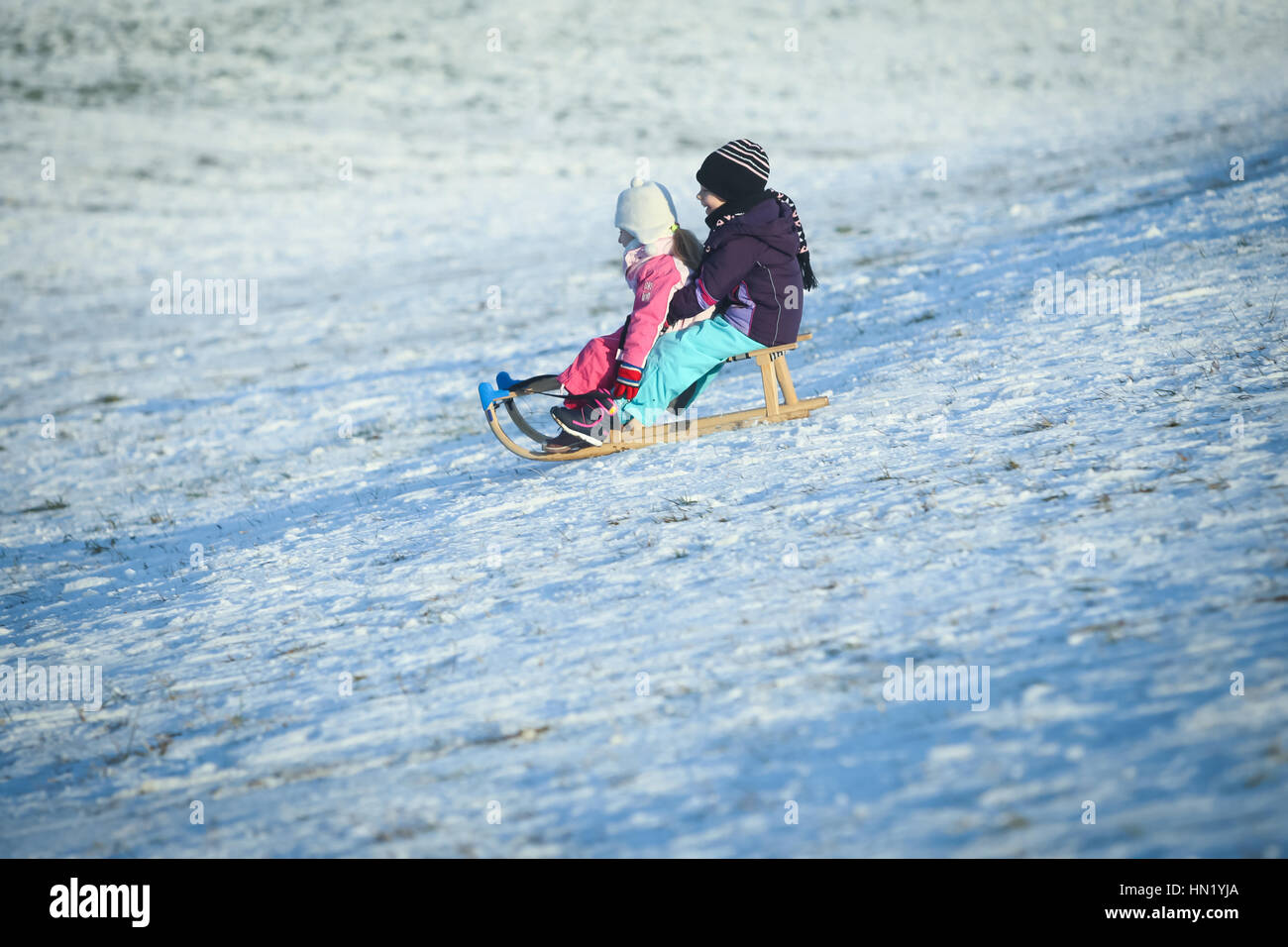 Kids Sledding Down Hill High Resolution Stock Photography and Images ...