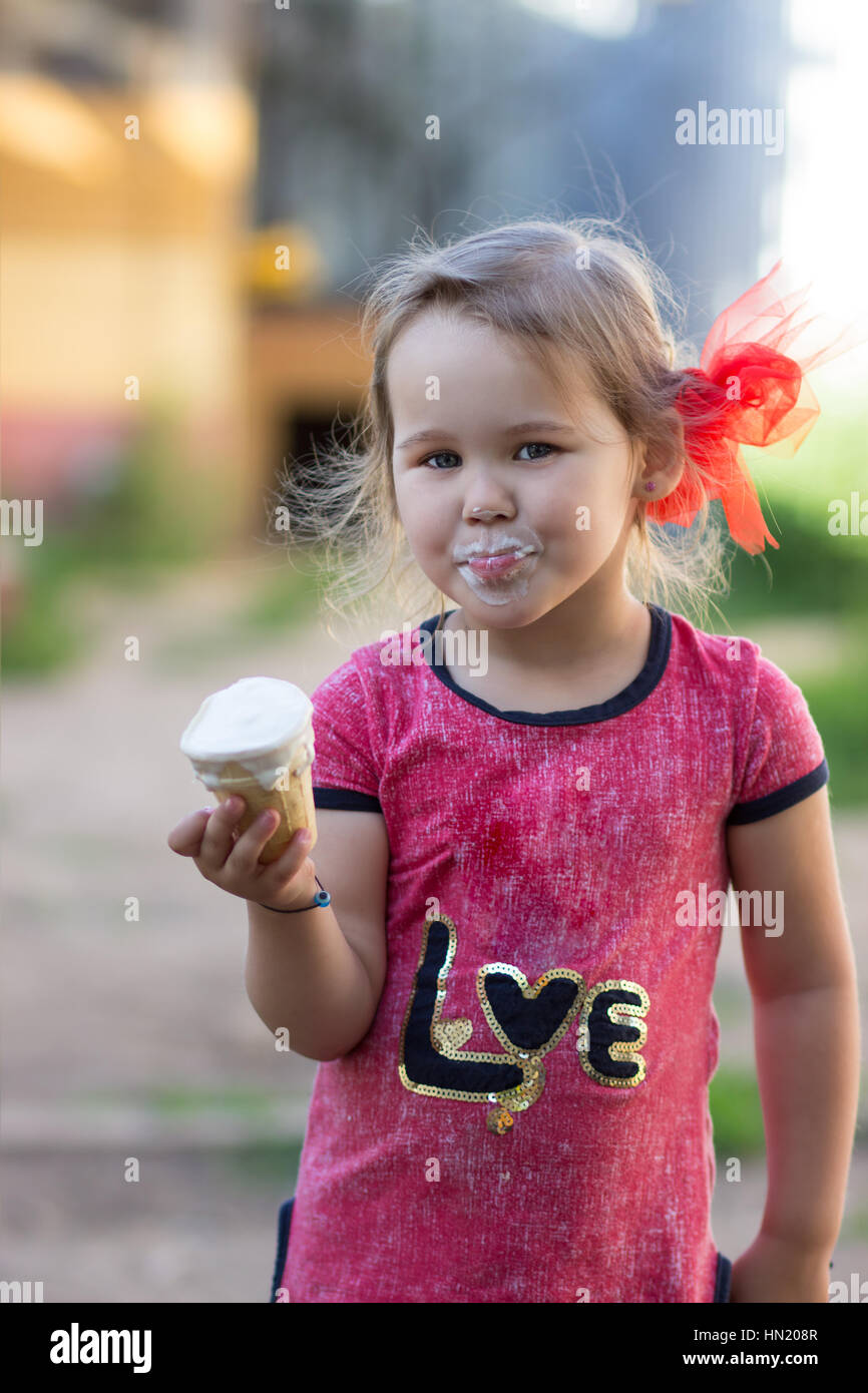 Child eating ice cream in a waffle cup Stock Photo - Alamy